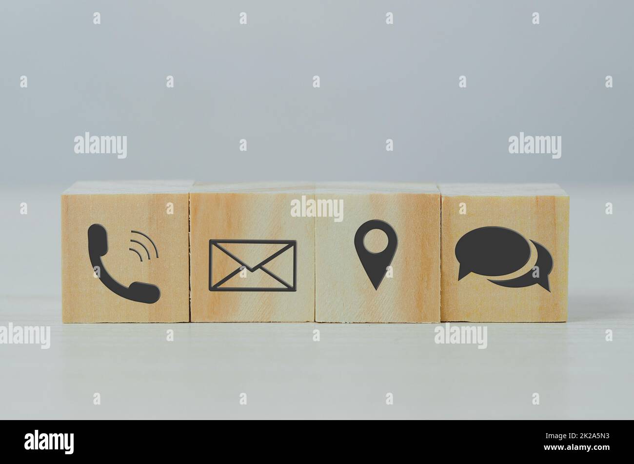 wooden cube block icon letter telephone location on table.Business ...