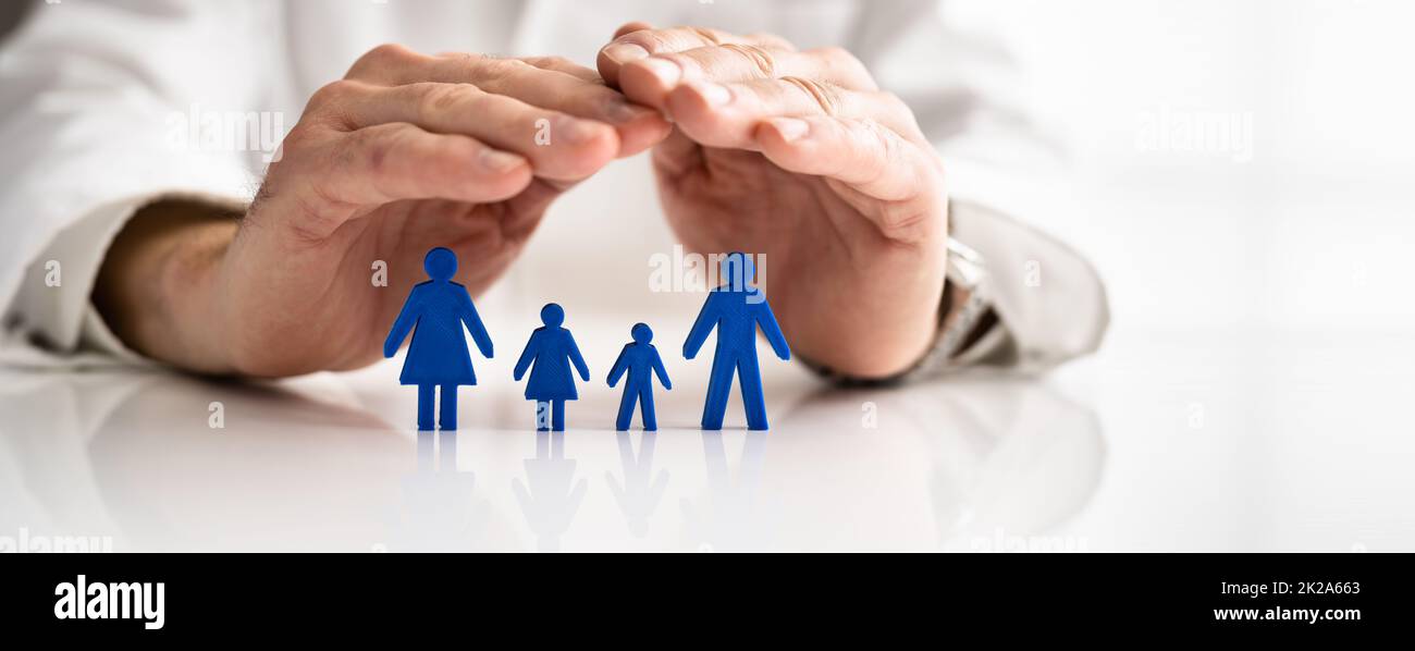 Doctor's Hand Protecting Pawn Family Stock Photo - Alamy