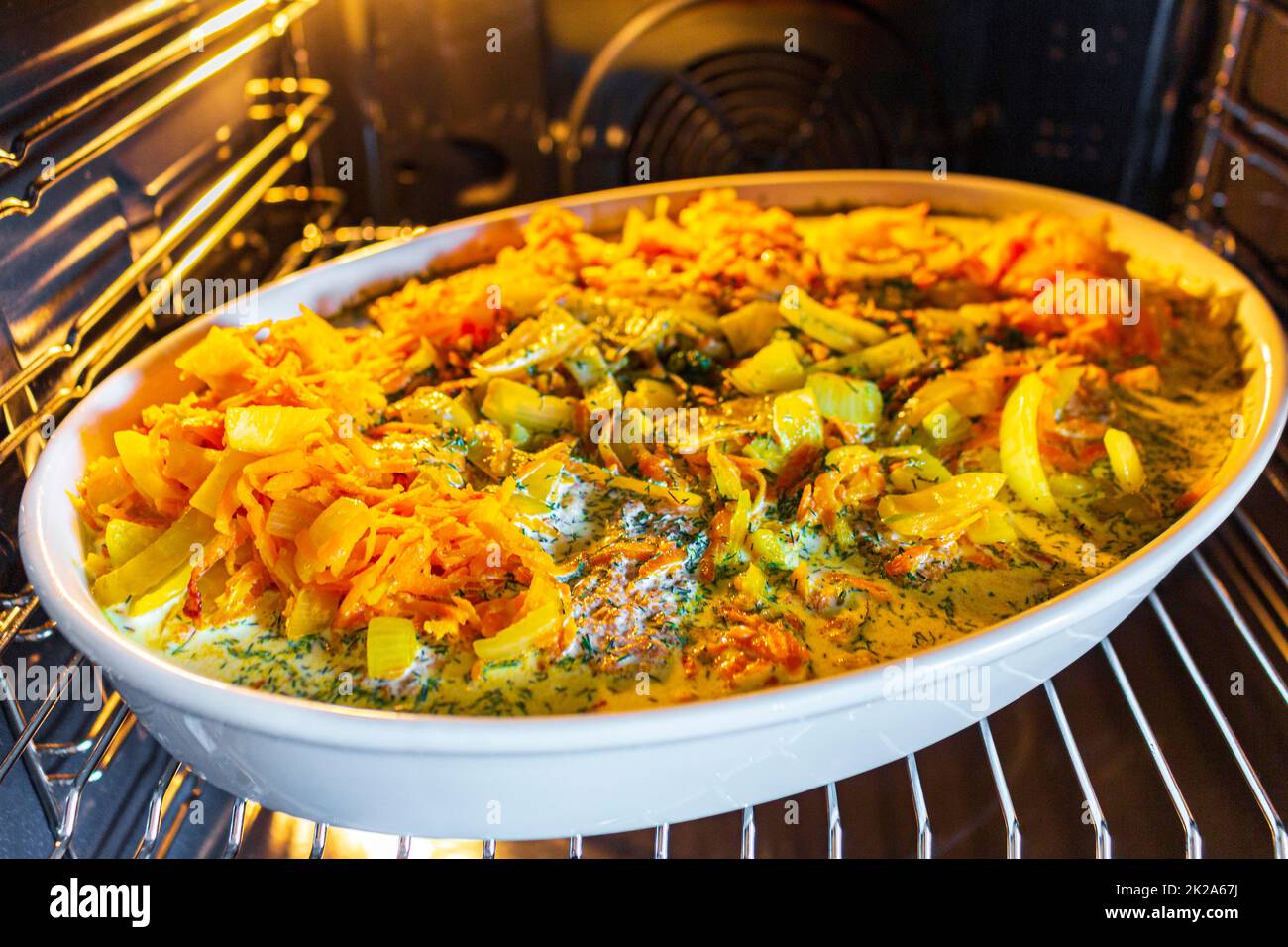 Making gratins fish sticks onions carrots noodles pasta meals Stock ...