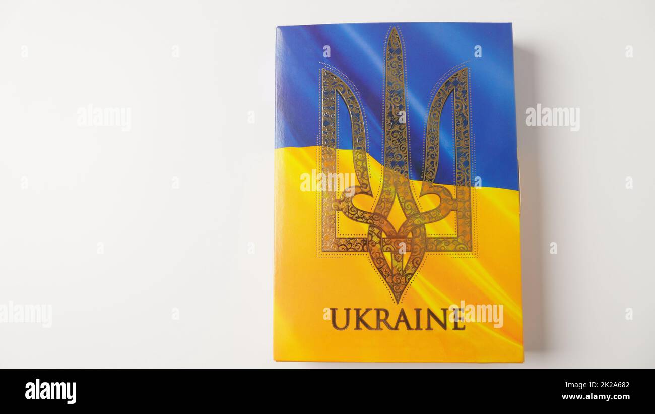 Ukraine flag and coat of arms. Golden trident on cloth flag. National ...