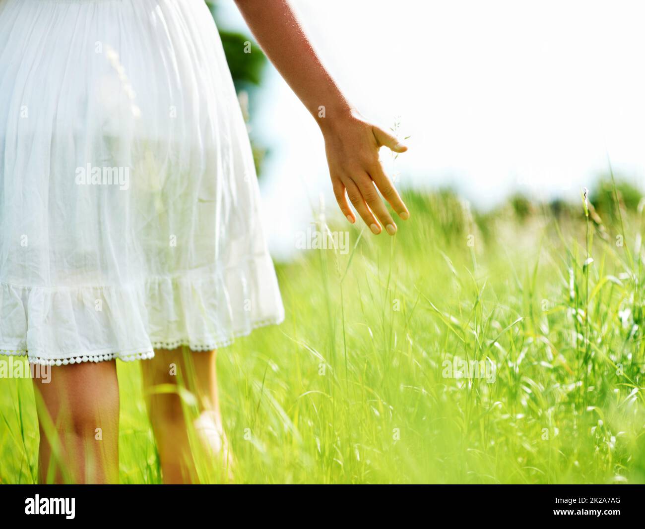 Beautiful young woman walking field hi-res stock photography and images ...