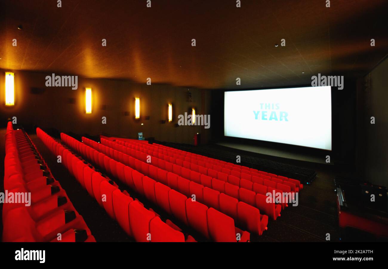 Lights, camera, action. An empty cinema or movie theatre with a big ...