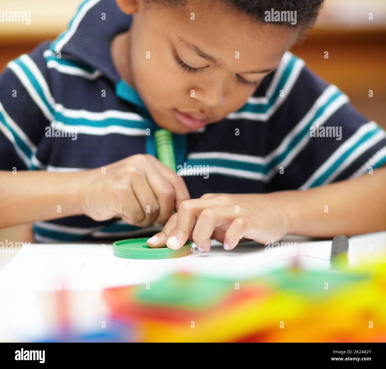 Boy Coloring With Crayons