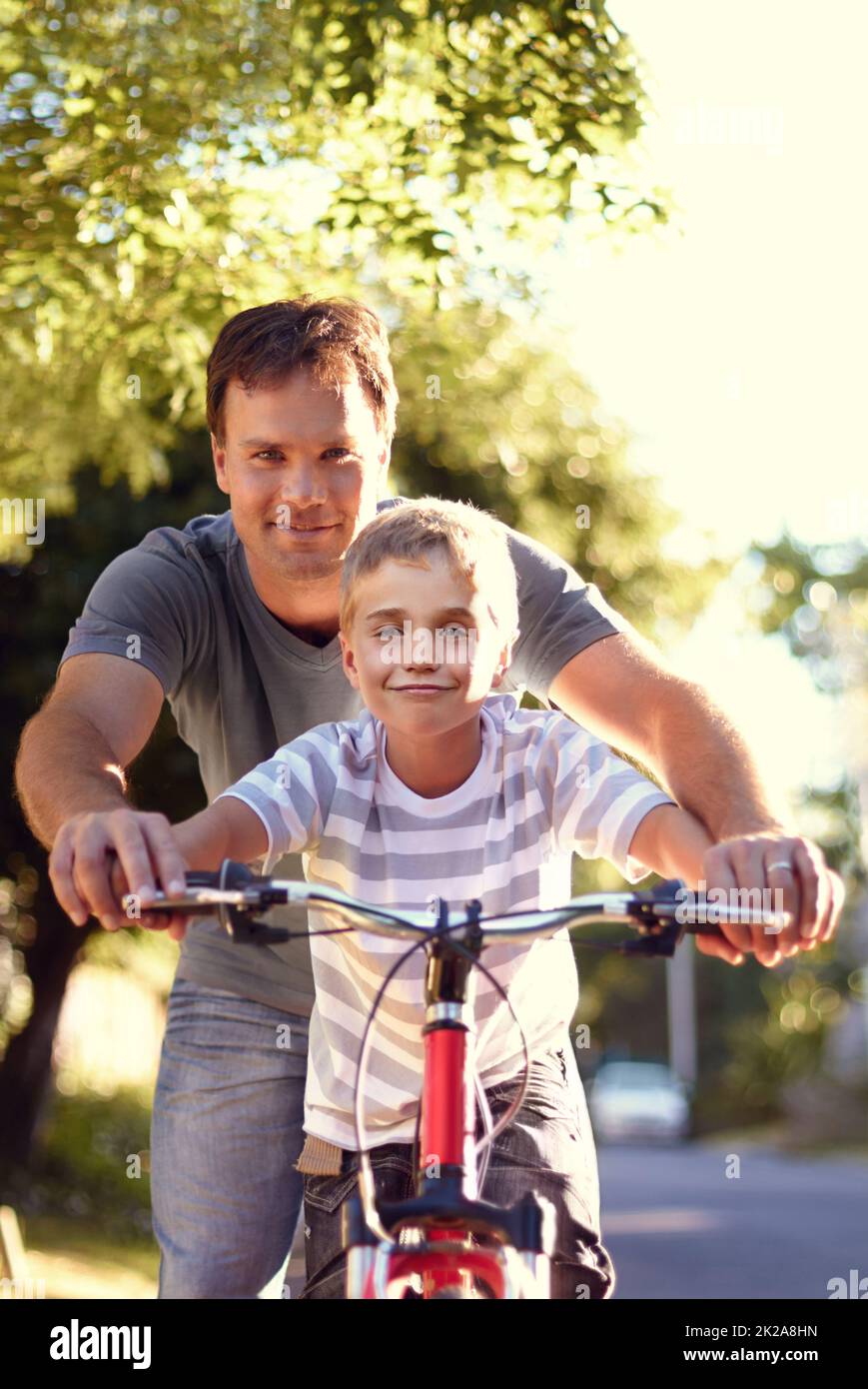 Boy learning to ride bike hi-res stock photography and images - Alamy