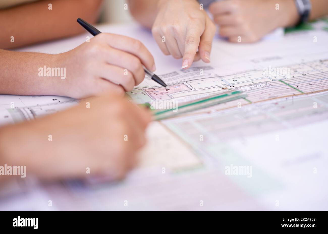 Business people reviewing blueprints desk hi-res stock photography and ...