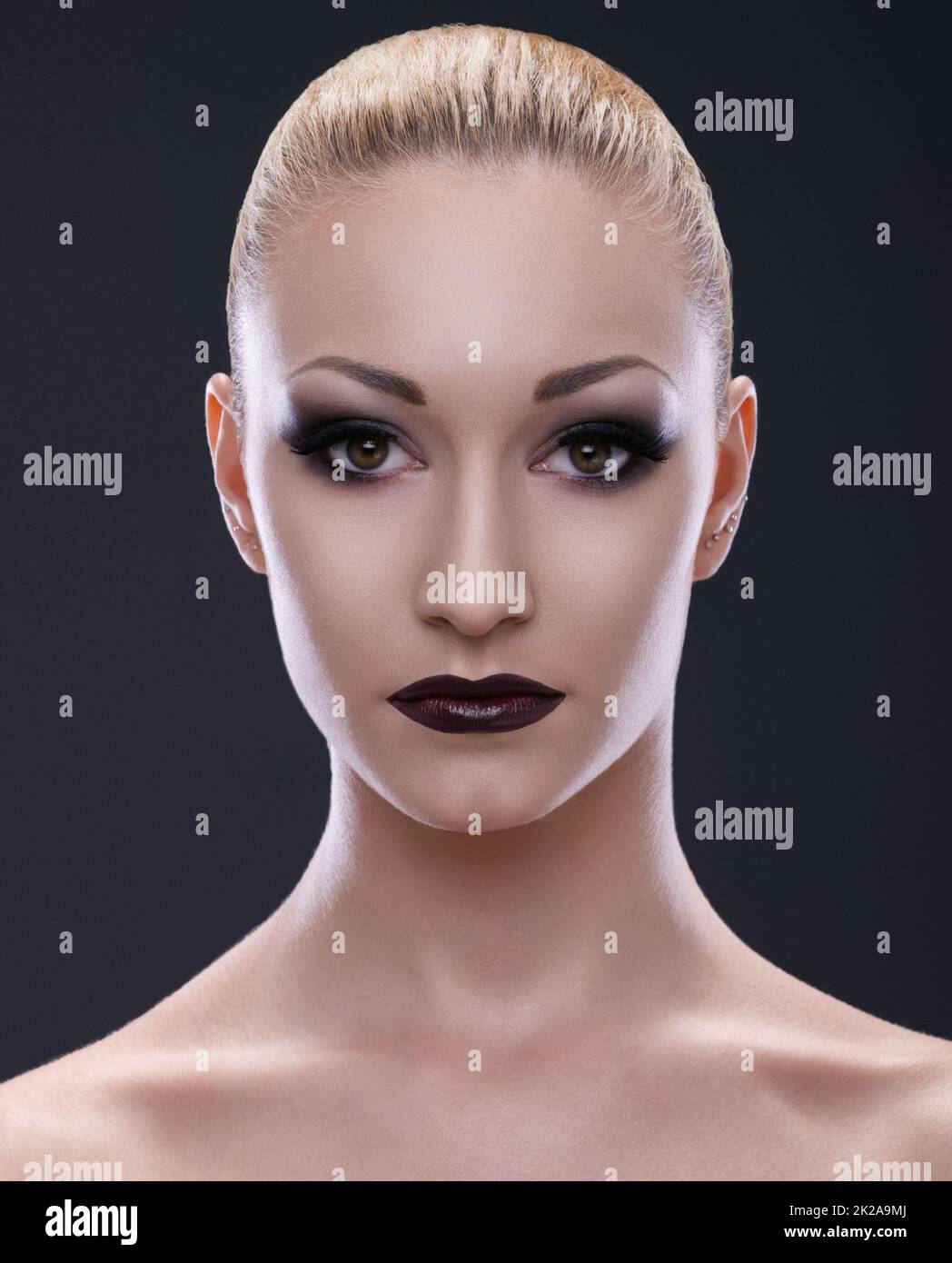 Intense beauty. Cropped portrait of a young woman wearing dark makeup ...