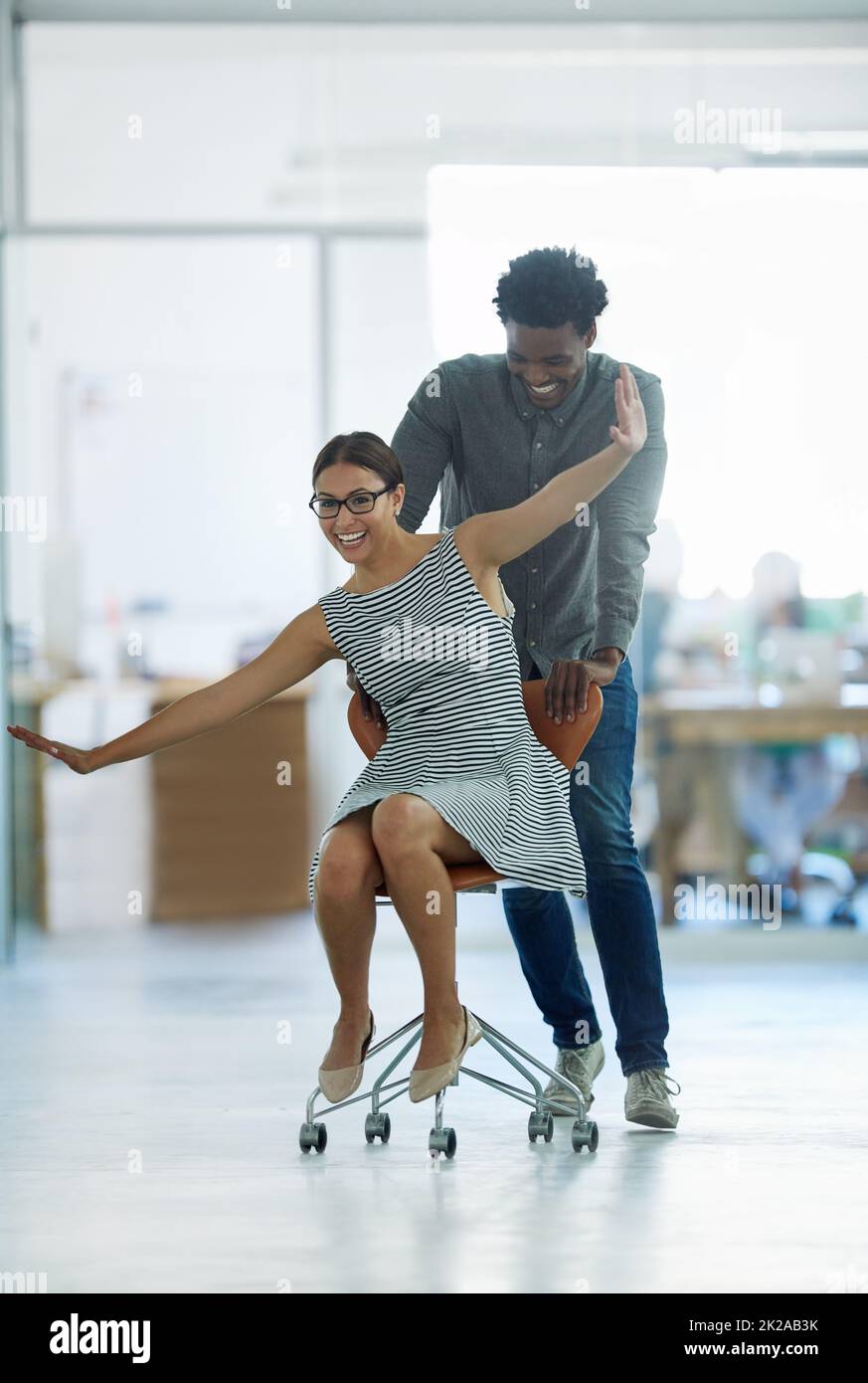 This office is never boring. a male coworker pushing his female ...