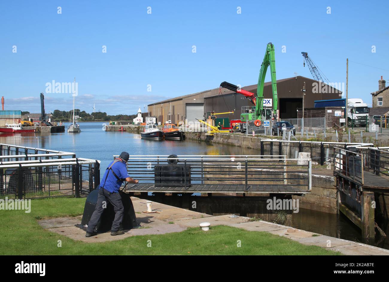 Opening lock gates to for a yacht entering through open entrance to ...