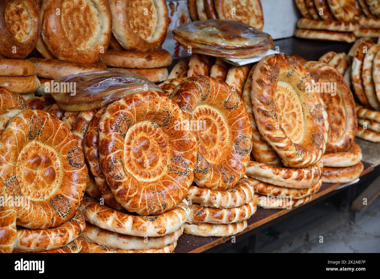 Tandyr nan, tandoor bread, sold in Kyrgyzstan. Central market in ...