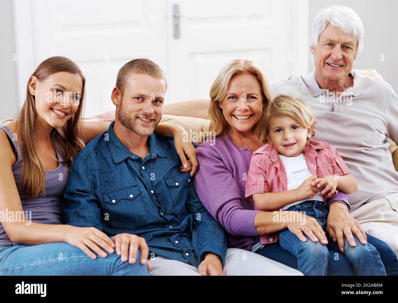 Were one big family. Portrait of a happy family sitting with their ...