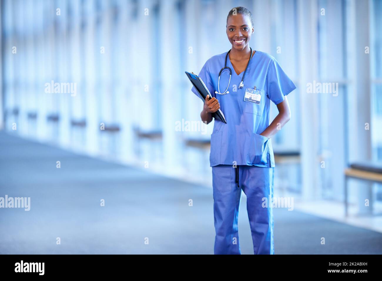 Smiling after surgery. Portrait of a young female doctor holding a ...