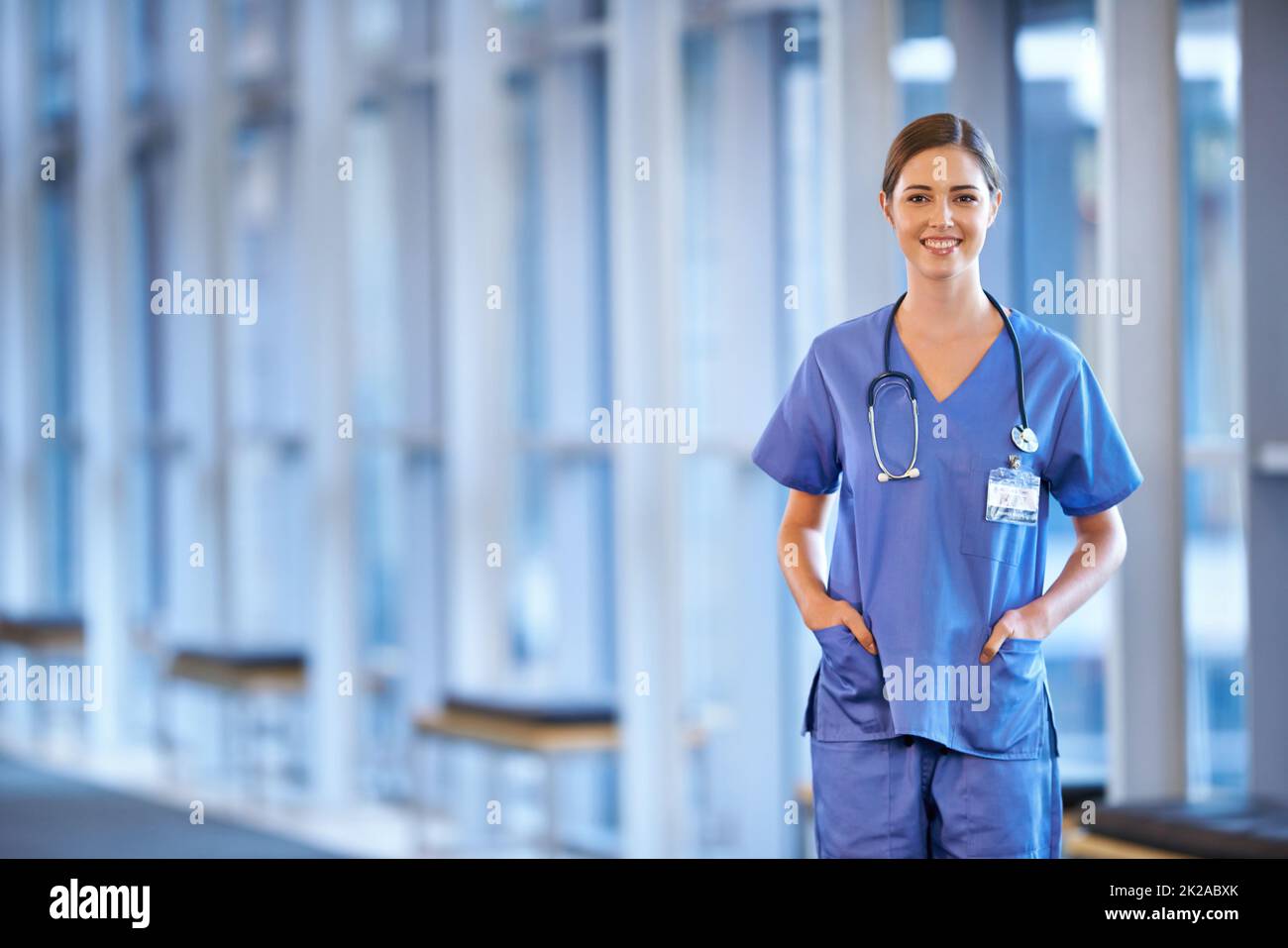 Doctor smiling in hospital hallway hi-res stock photography and images ...