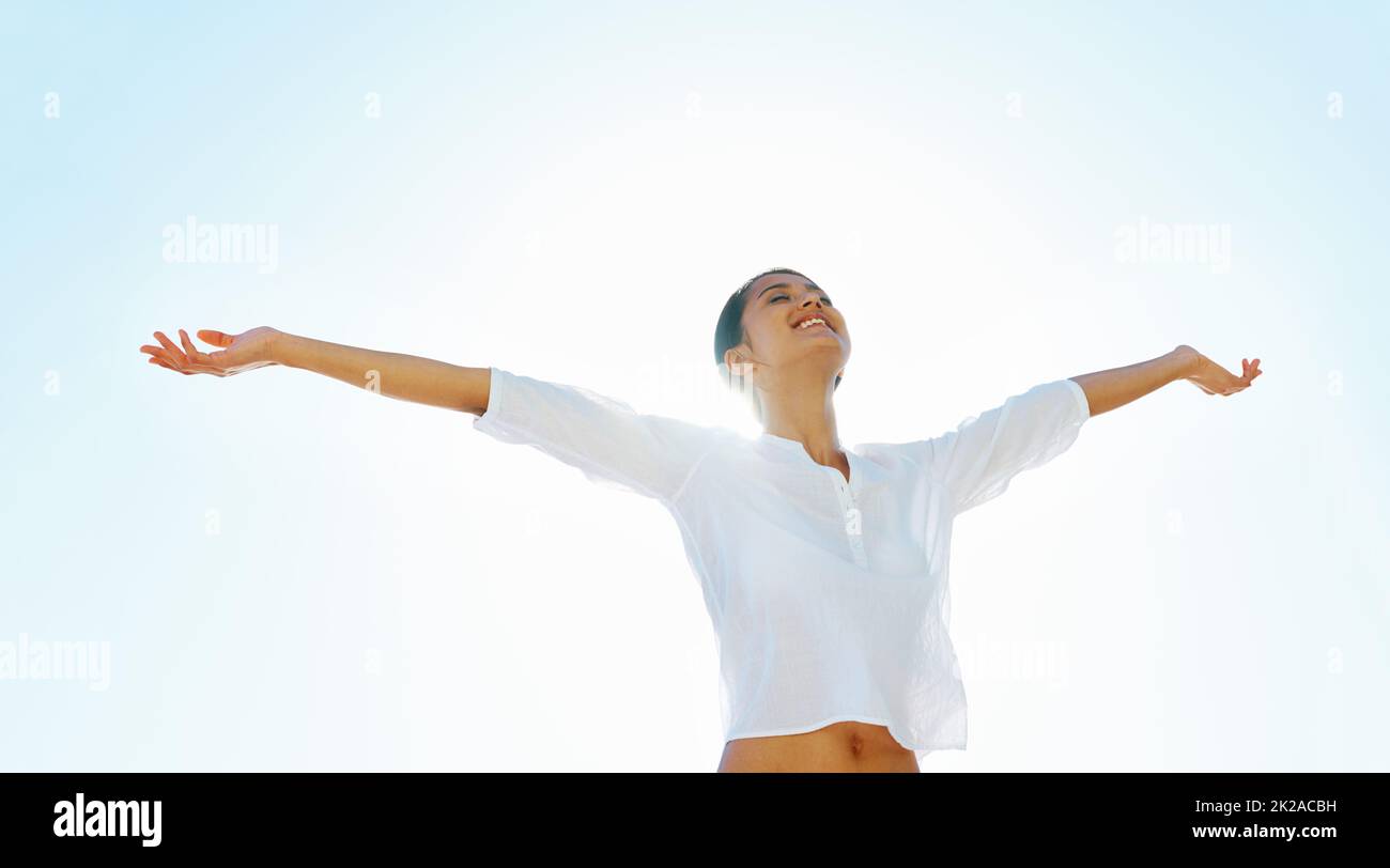 Letting go and feeling the freedom. Beautiful woman on the beach with ...