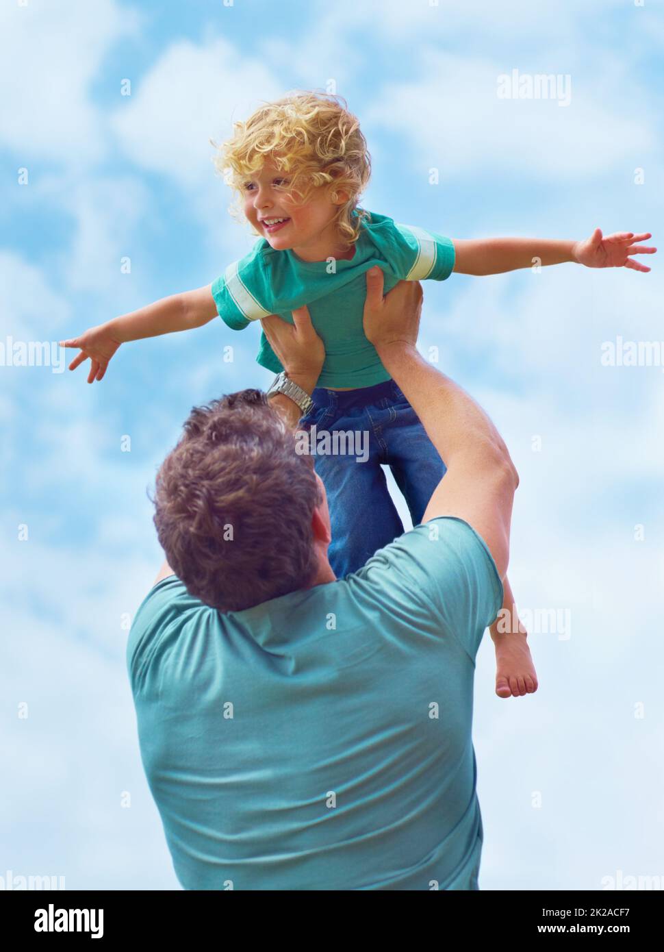 Kids swinging with parents hi-res stock photography and images - Alamy