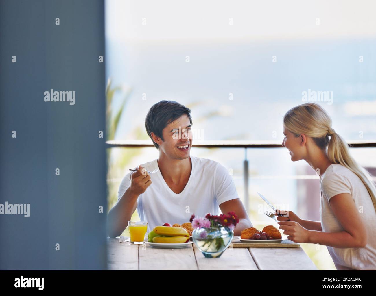 Share a breakfast with your beloved. Shot of a happy young couple ...