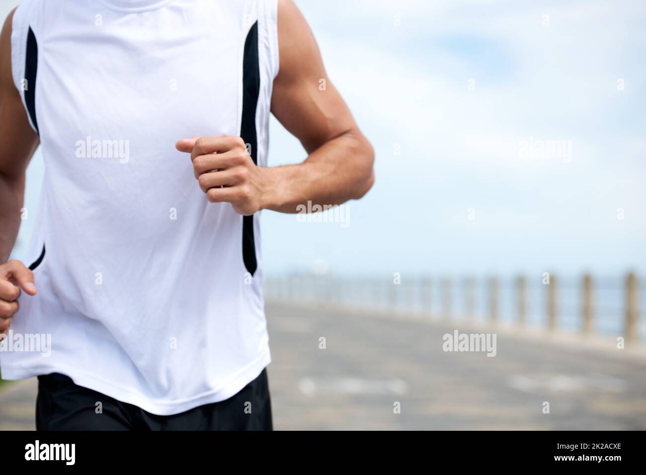 Push your body beyond its limits. Cropped image of a fit and athletic ...