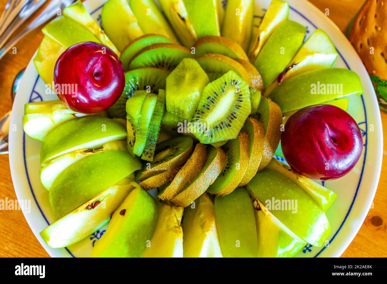 Colorful fruits breakfast food cut and served on a plate Stock Photo ...