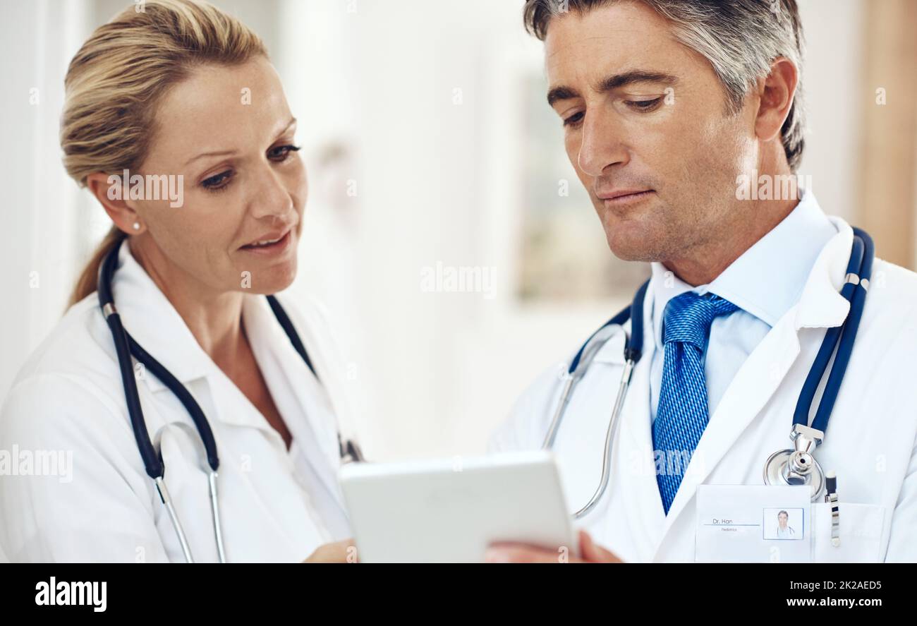 Two doctors talking hospital hi-res stock photography and images - Alamy