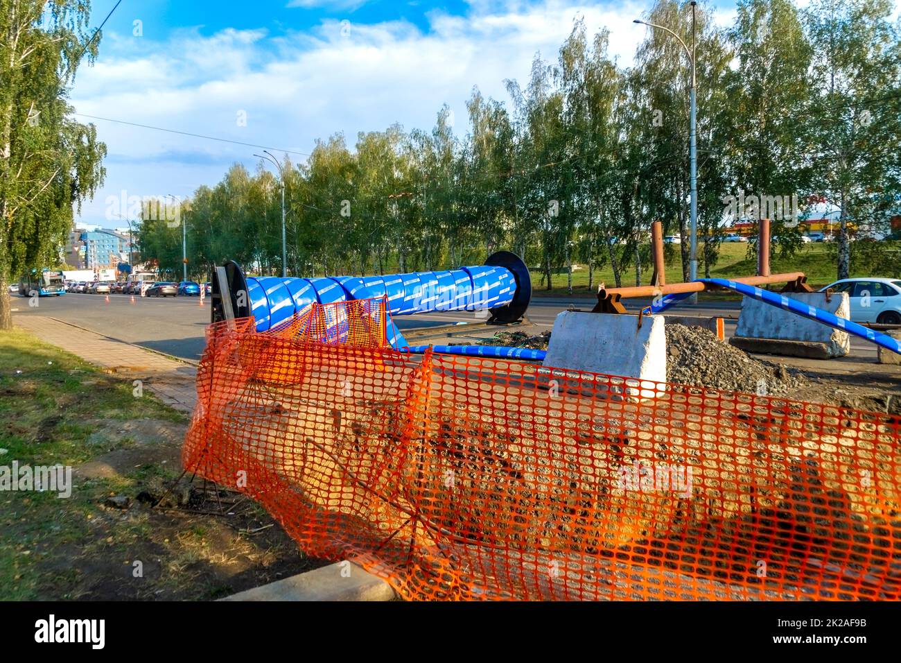 restoration of a pipeline under a city street using a repair sleeve of ...