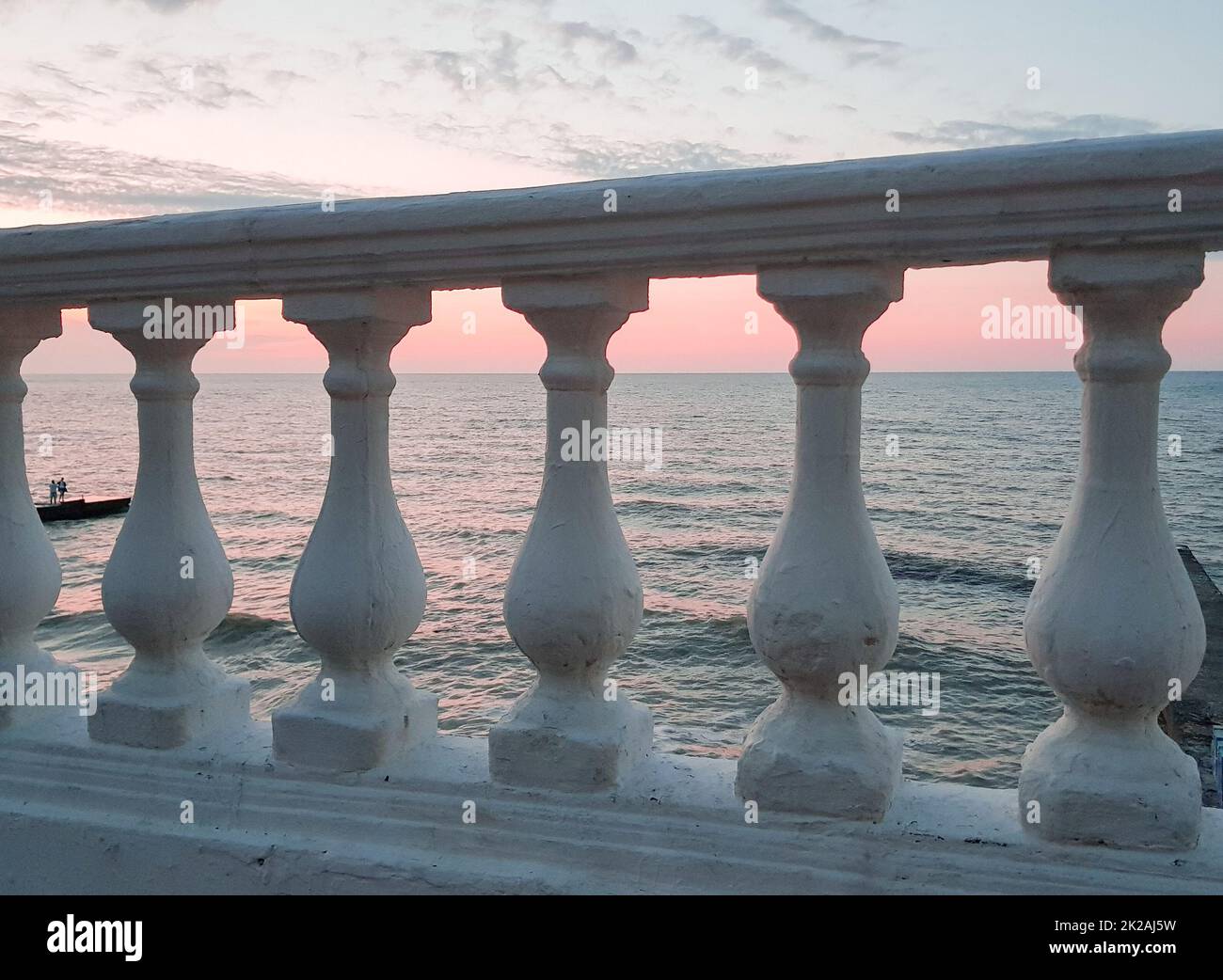 Classic white plaster balustrade on the background of a calm sea at ...