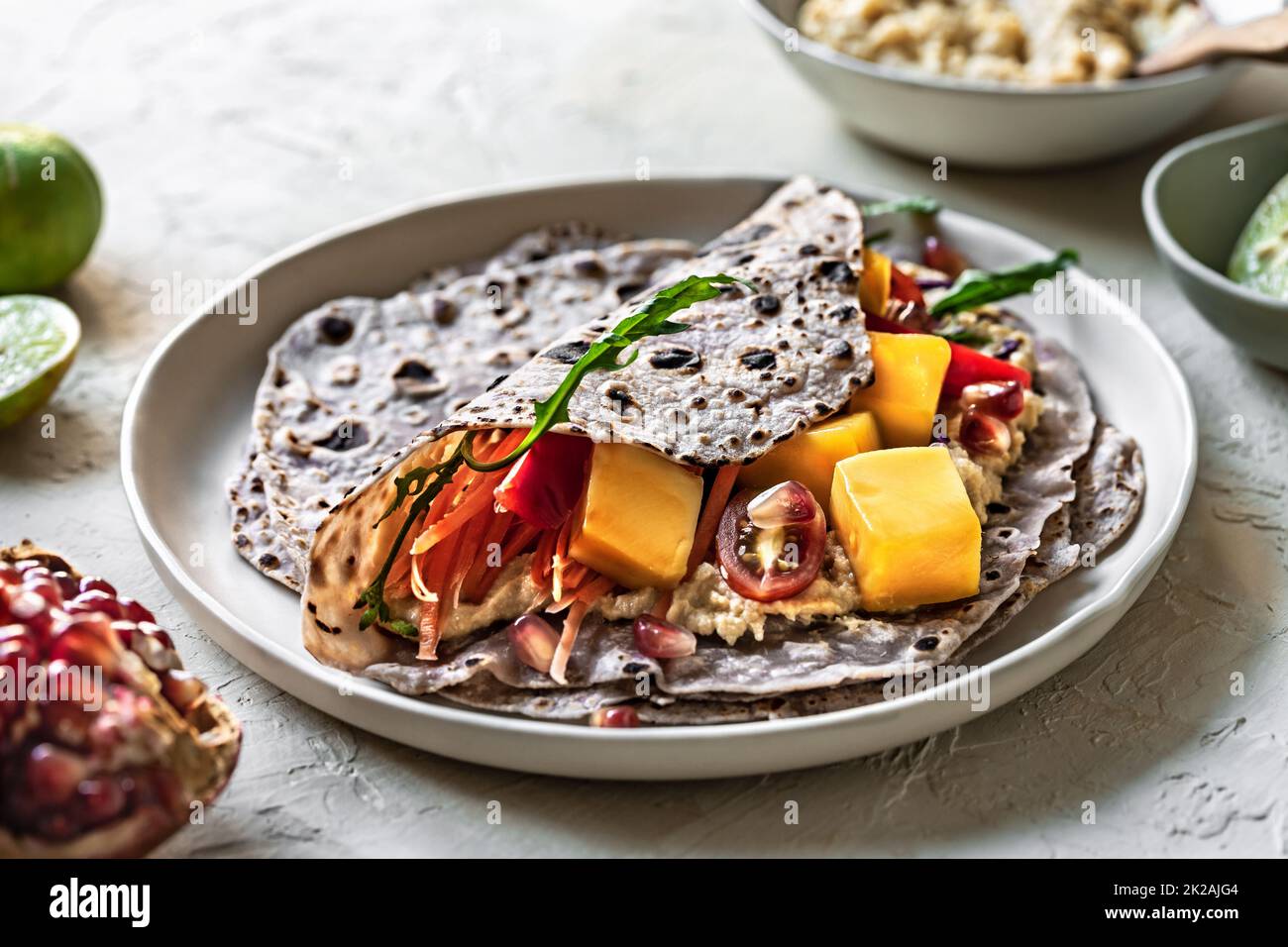 Mango Rocket Pomegranate in Sweet Purple Potato Tortilla wrap Stock ...