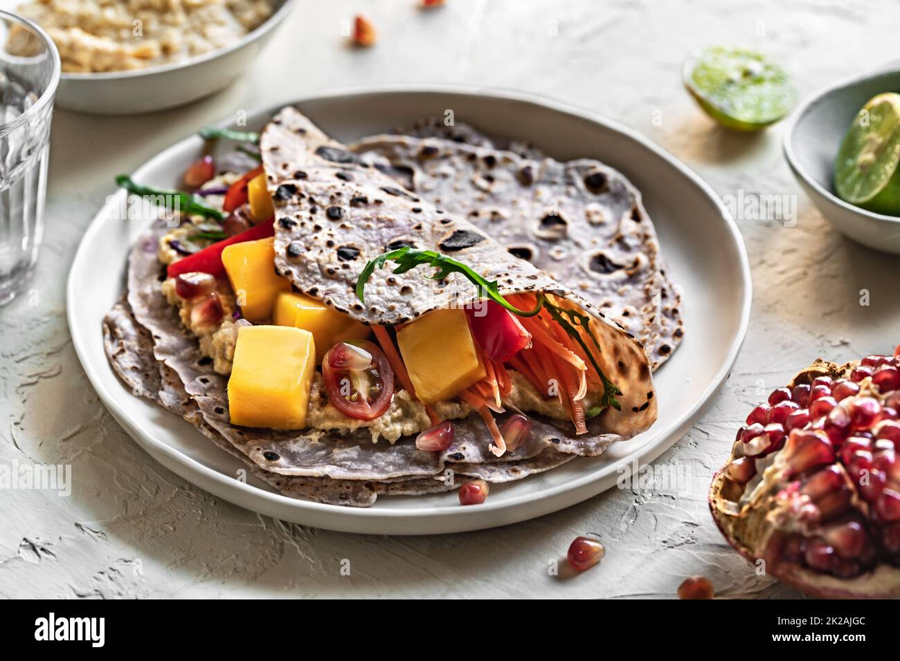 Mango Rocket Pomegranate in Sweet Purple Potato Tortilla wrap Stock ...
