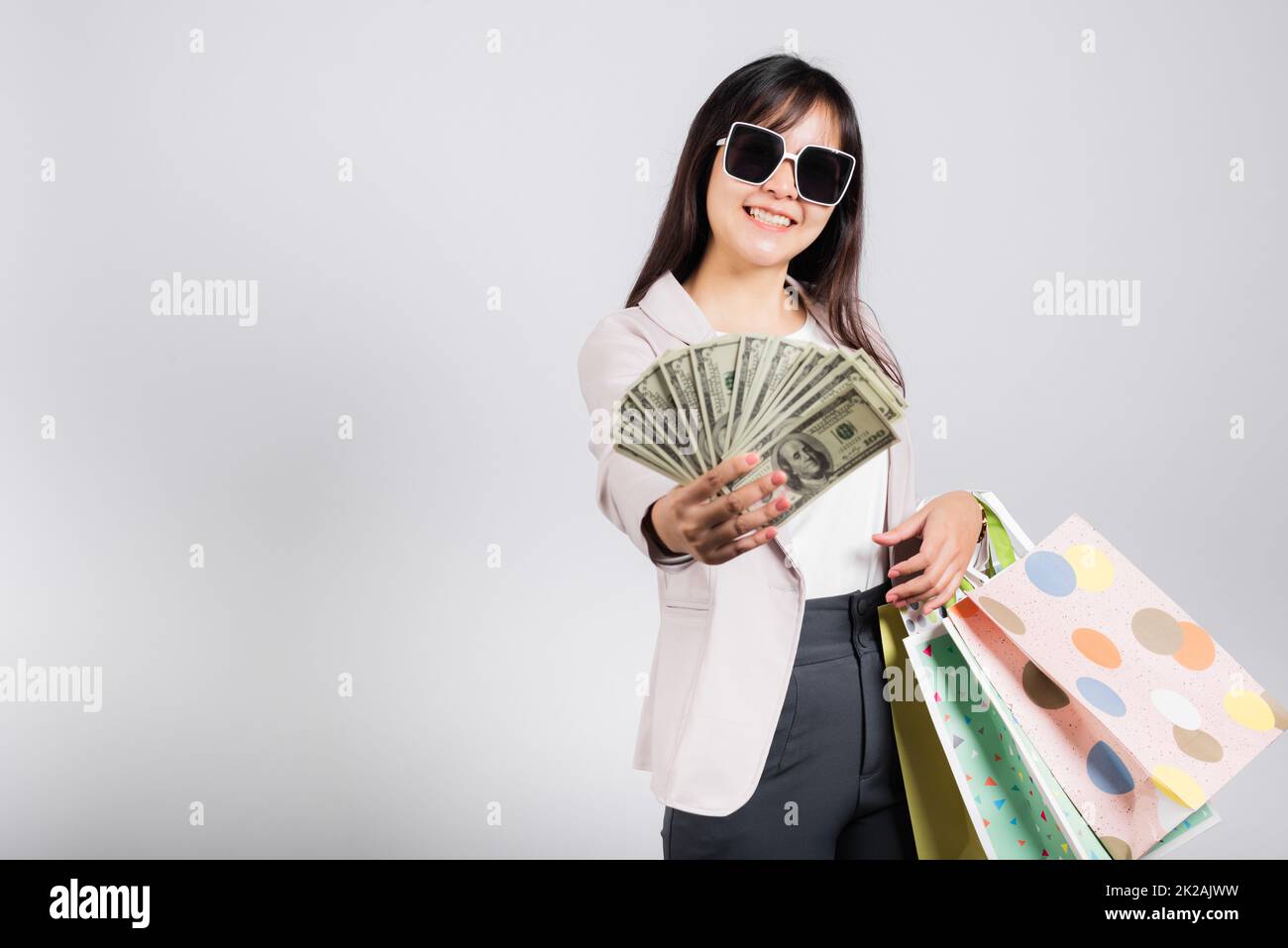 Woman with glasses confident shopper smile holding online shopping bags ...