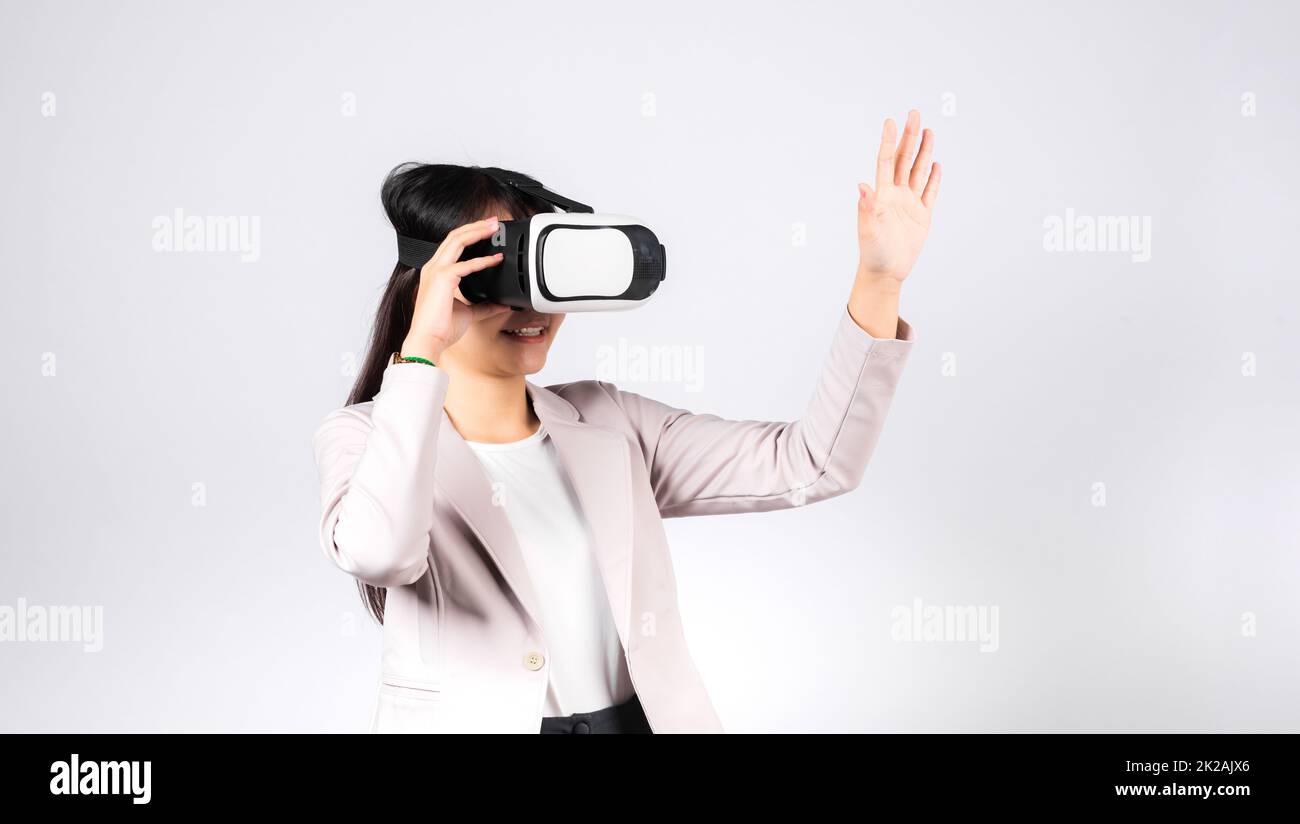 Smiling woman confidence excited wear VR headset device touching air ...