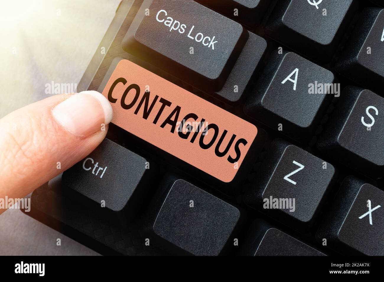 Text sign showing Contagious. Concept meaning transmissible by direct ...