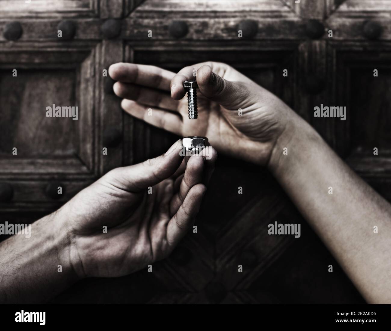 Hands holding nuts bolts hi-res stock photography and images - Alamy