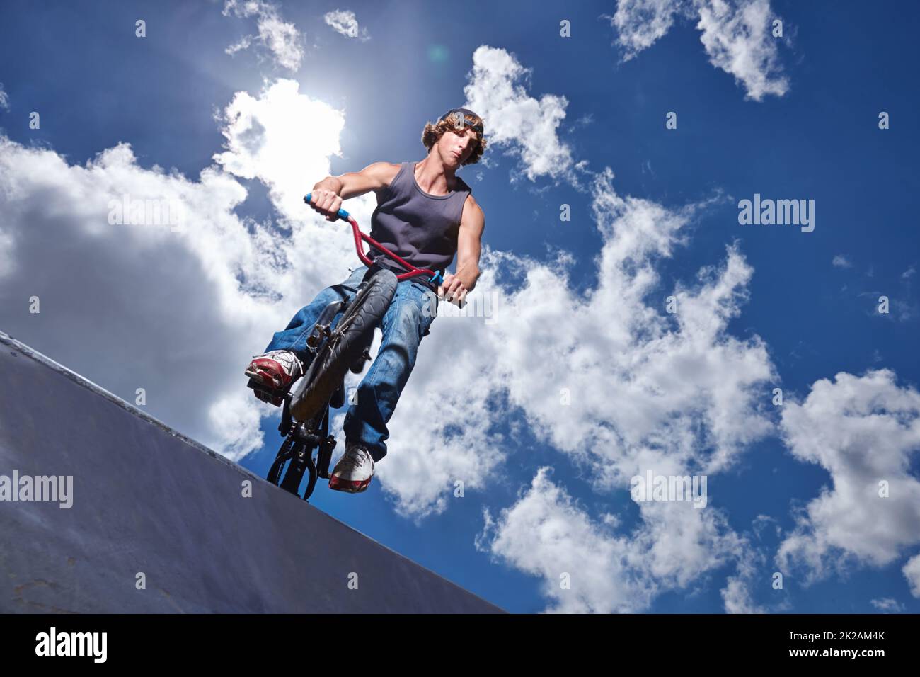 Practicing for the x games. Full length shot of a teenage boy riding a ...
