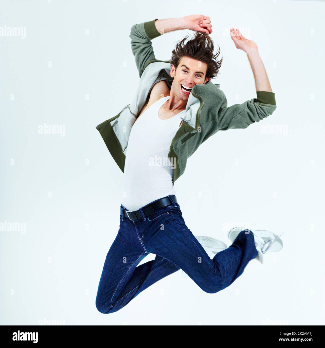 Happy young man jumping hi-res stock photography and images - Alamy