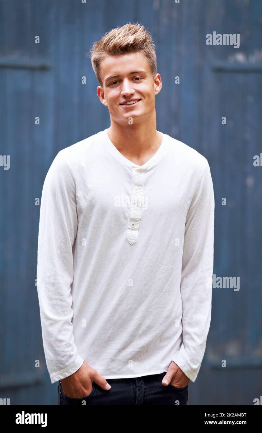 Hes a gentlemen by choice. Portrait of a handsome young man standing ...