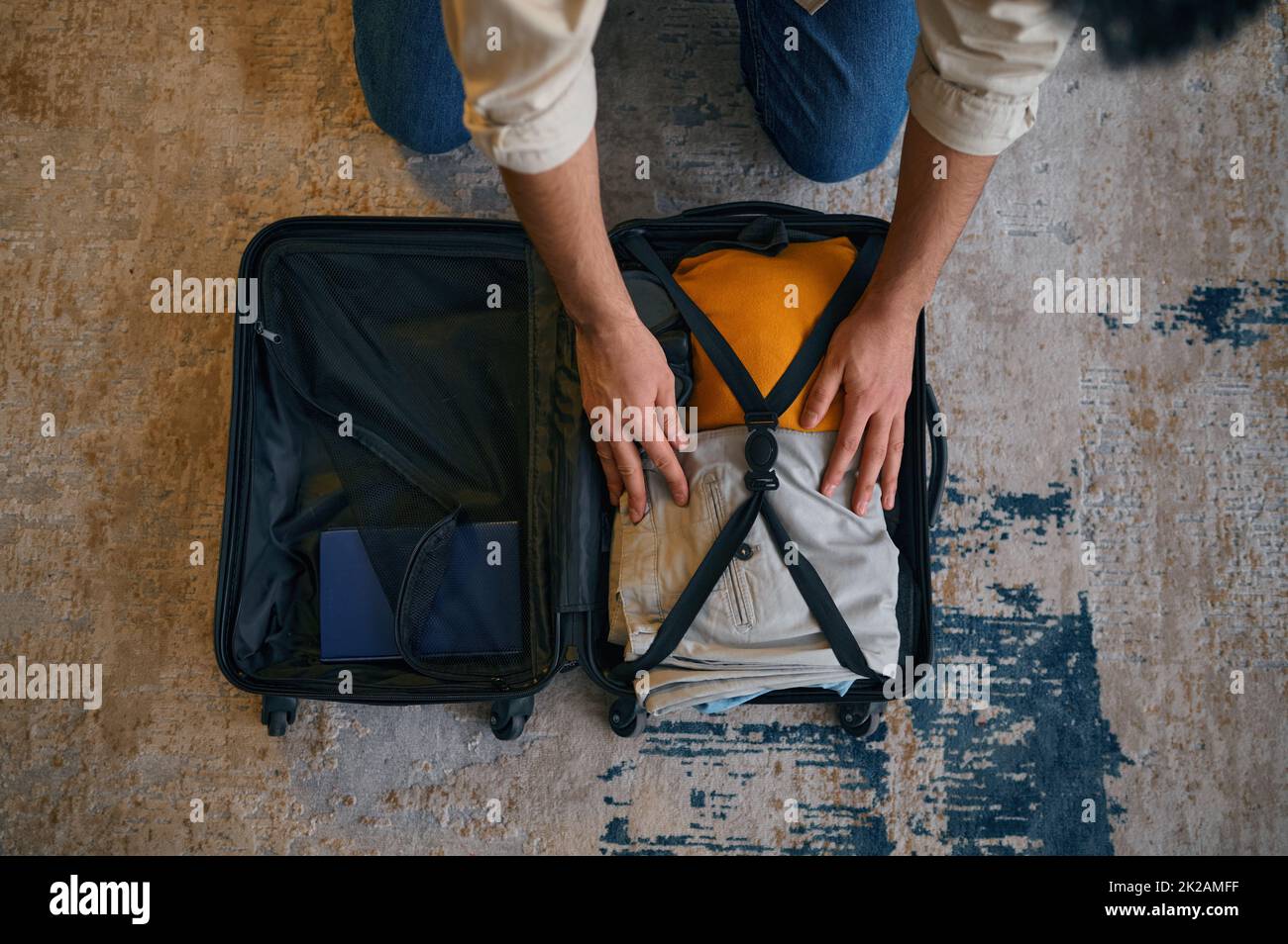 Businessman packing clothes hands suitcase hi-res stock photography and ...