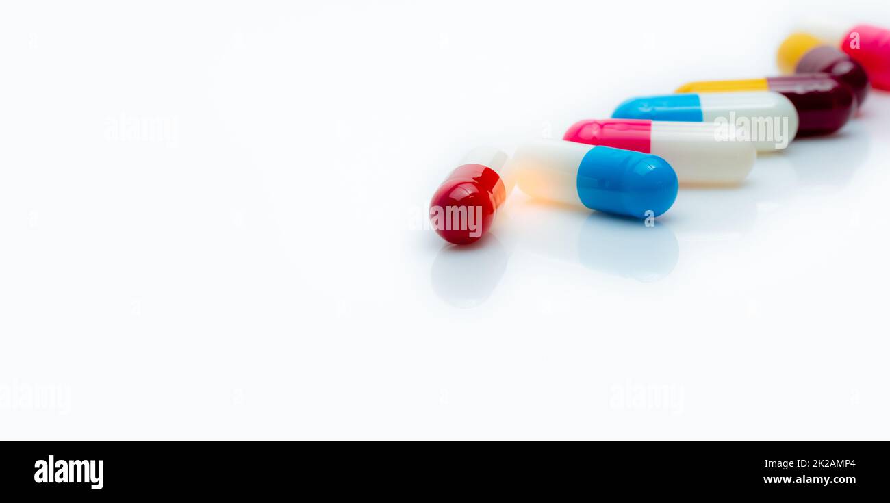 Selective focus on antibiotic capsule pills on white background ...