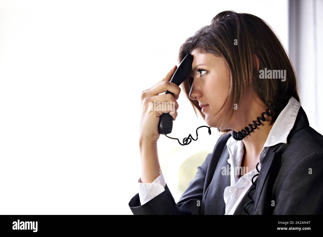 The call that ruined her day.... A bored businesswoman with a phone ...