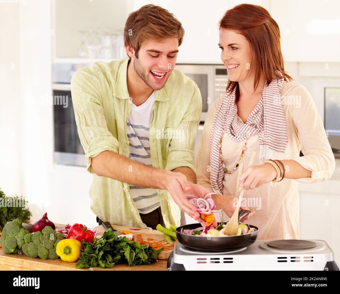 Husband hold wife in kitchen hi-res stock photography and images - Alamy