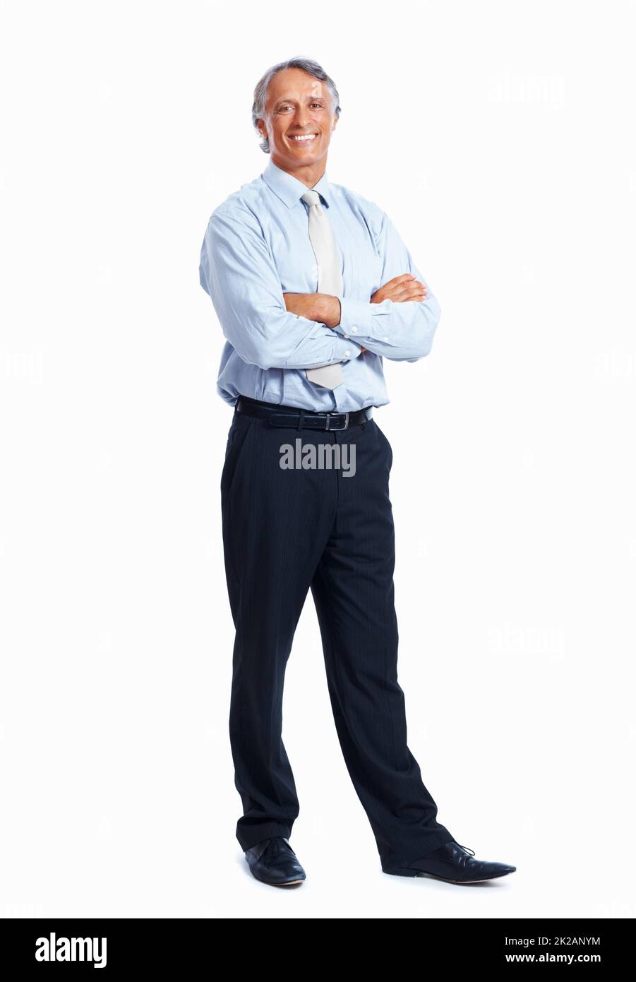 Mature business man standing with arms crossed. Full length of handsome mature business man ...