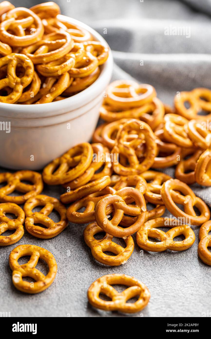 Mini pretzels. Crusty salted snack on kitchen table Stock Photo - Alamy