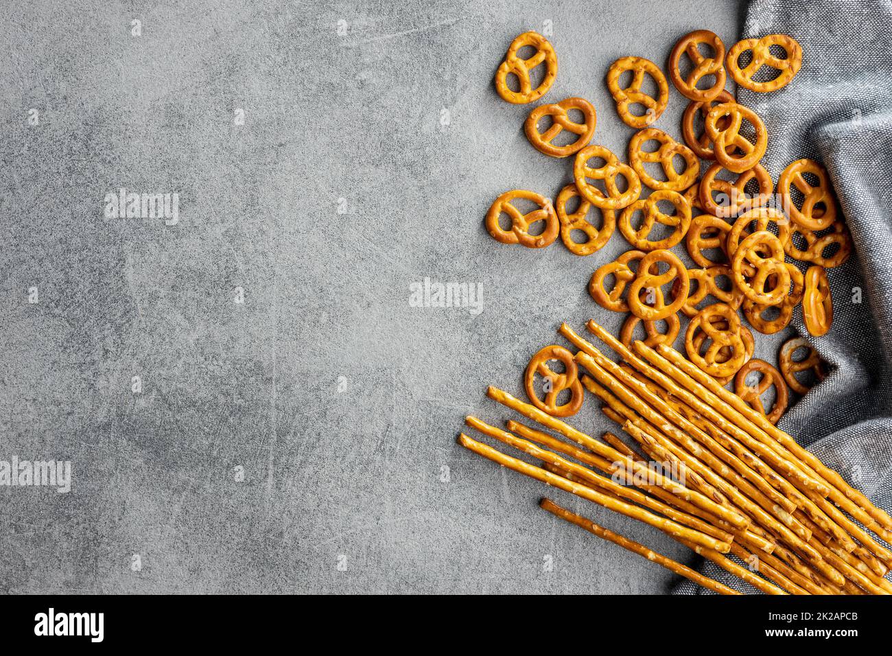 Mini pretzels and salted sticks. Crusty salted snack on kitchen table ...