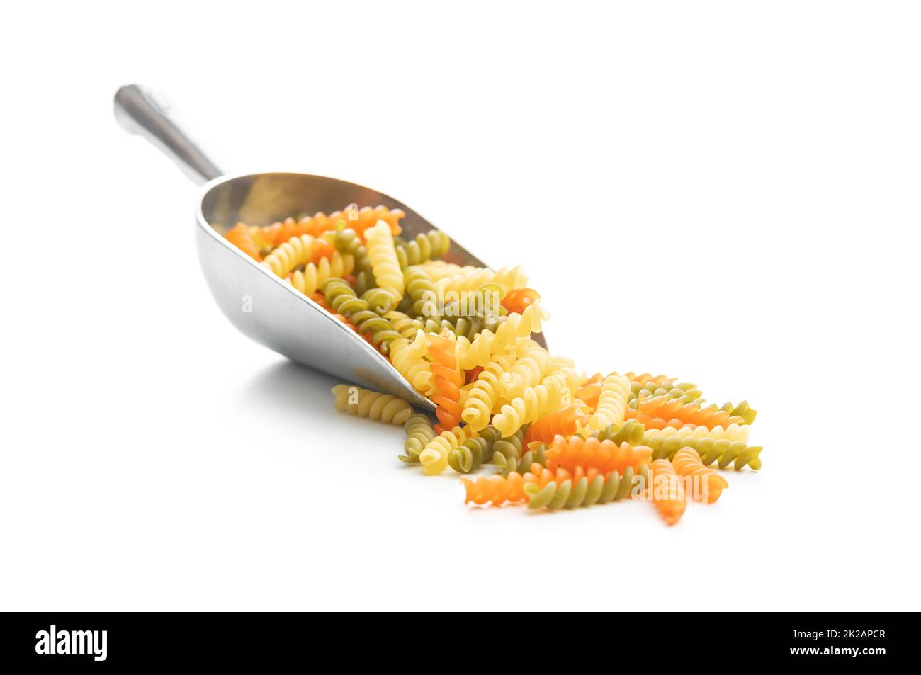Three colors fusilli pasta in scoop. Colorful italian raw pasta ...