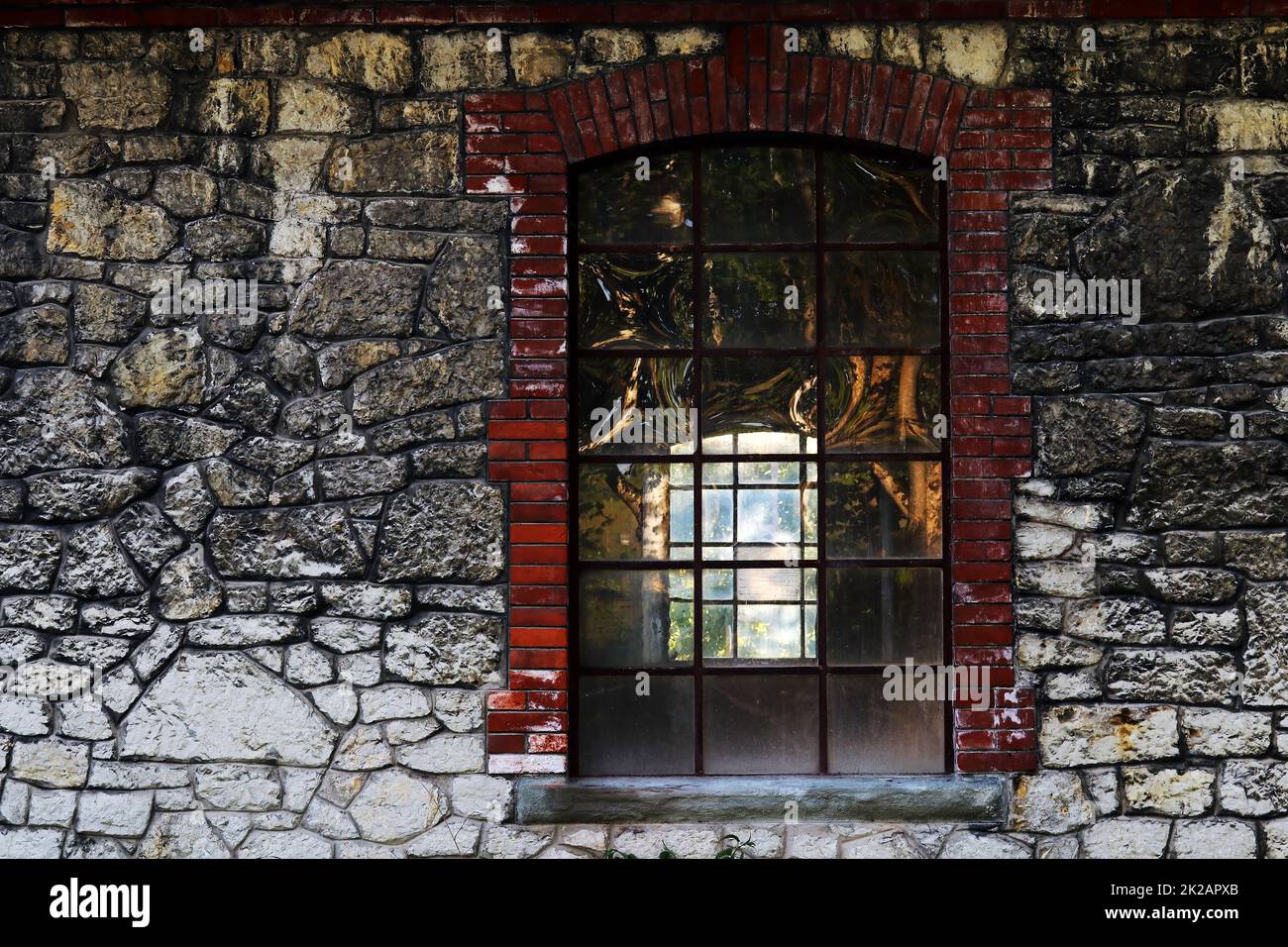 An old translucent window in a vacant building with stone wall Stock ...