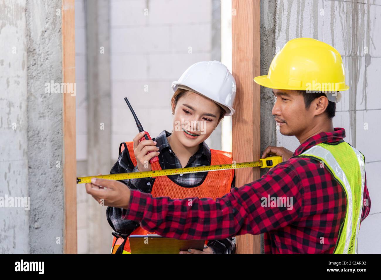 Male industrial builder workers installation process measuring wooden ...
