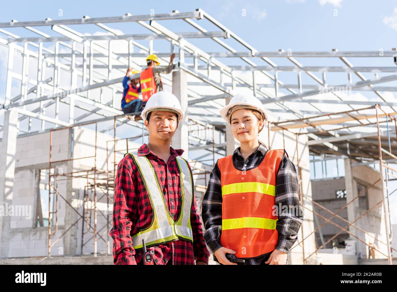 Architect and client standing at home building construction site Stock ...