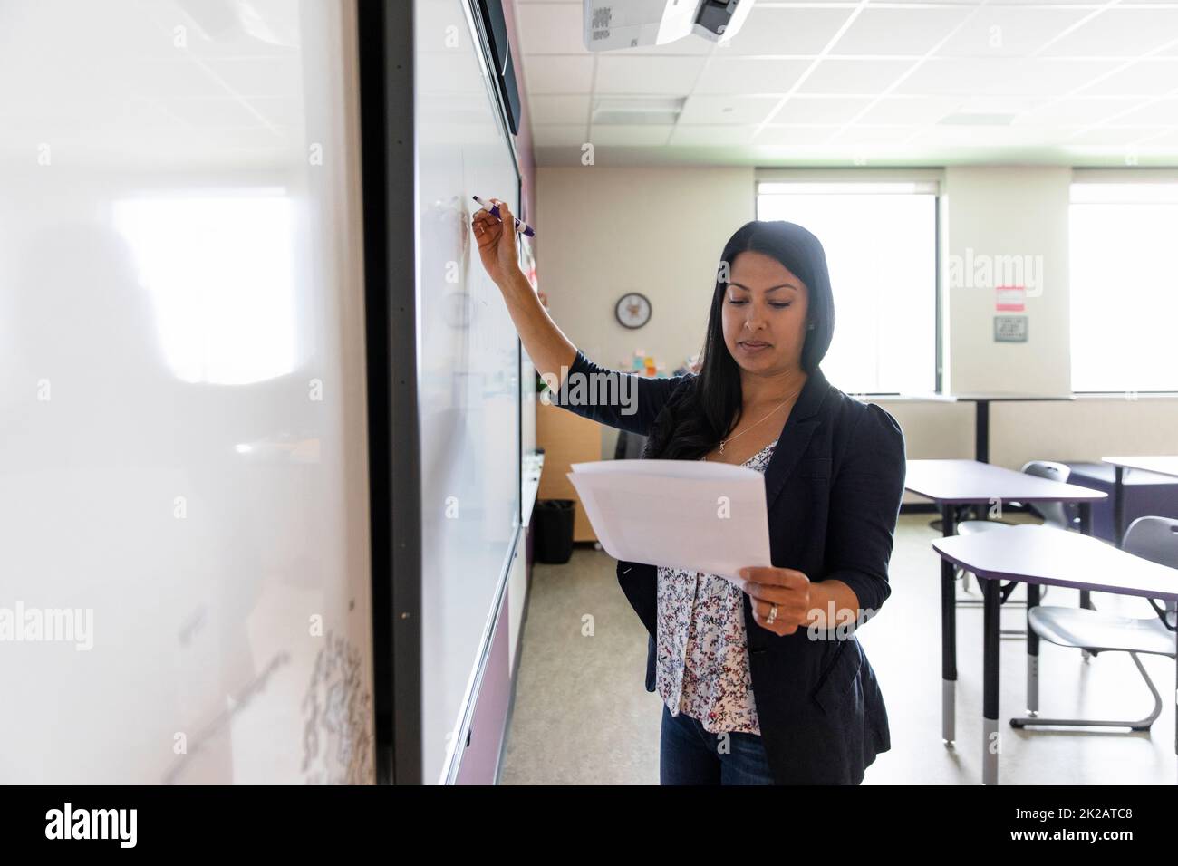 Teacher writing on paper hi-res stock photography and images - Alamy