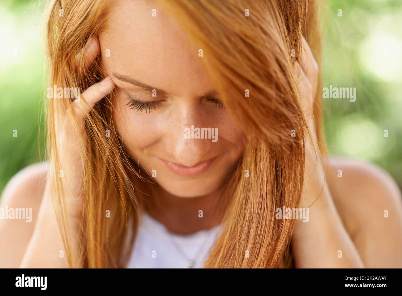 She might be shy, but her beauty shines through. Closeup shot of a ...
