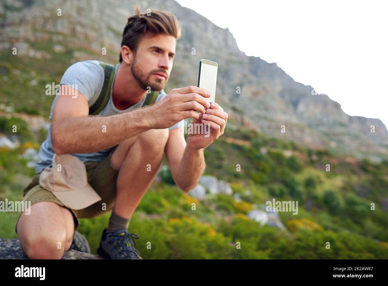 Getting some shots of the view. a handsome young man snapping pics ...