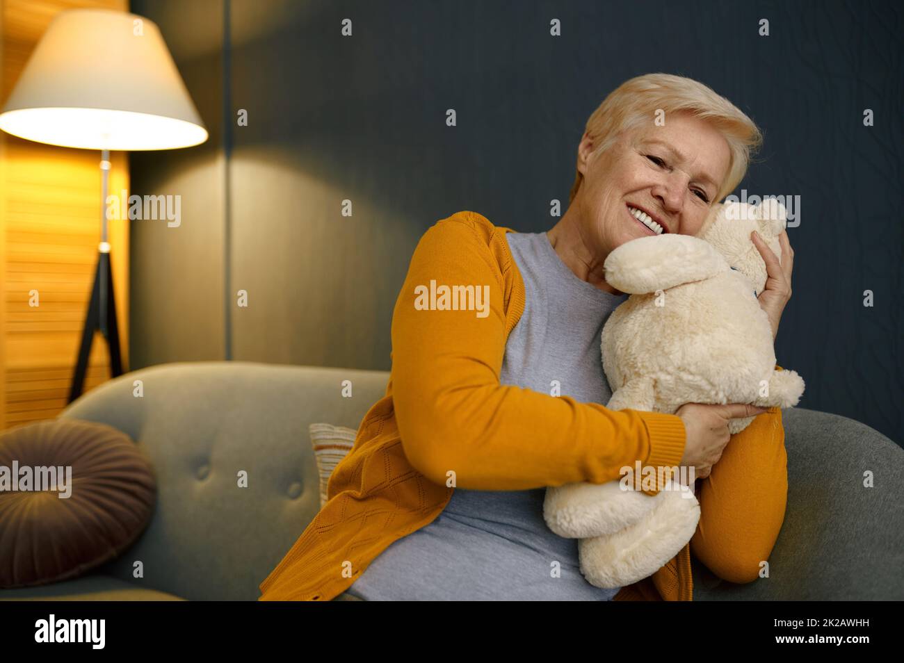 Old woman hugging teddy hi-res stock photography and images - Alamy