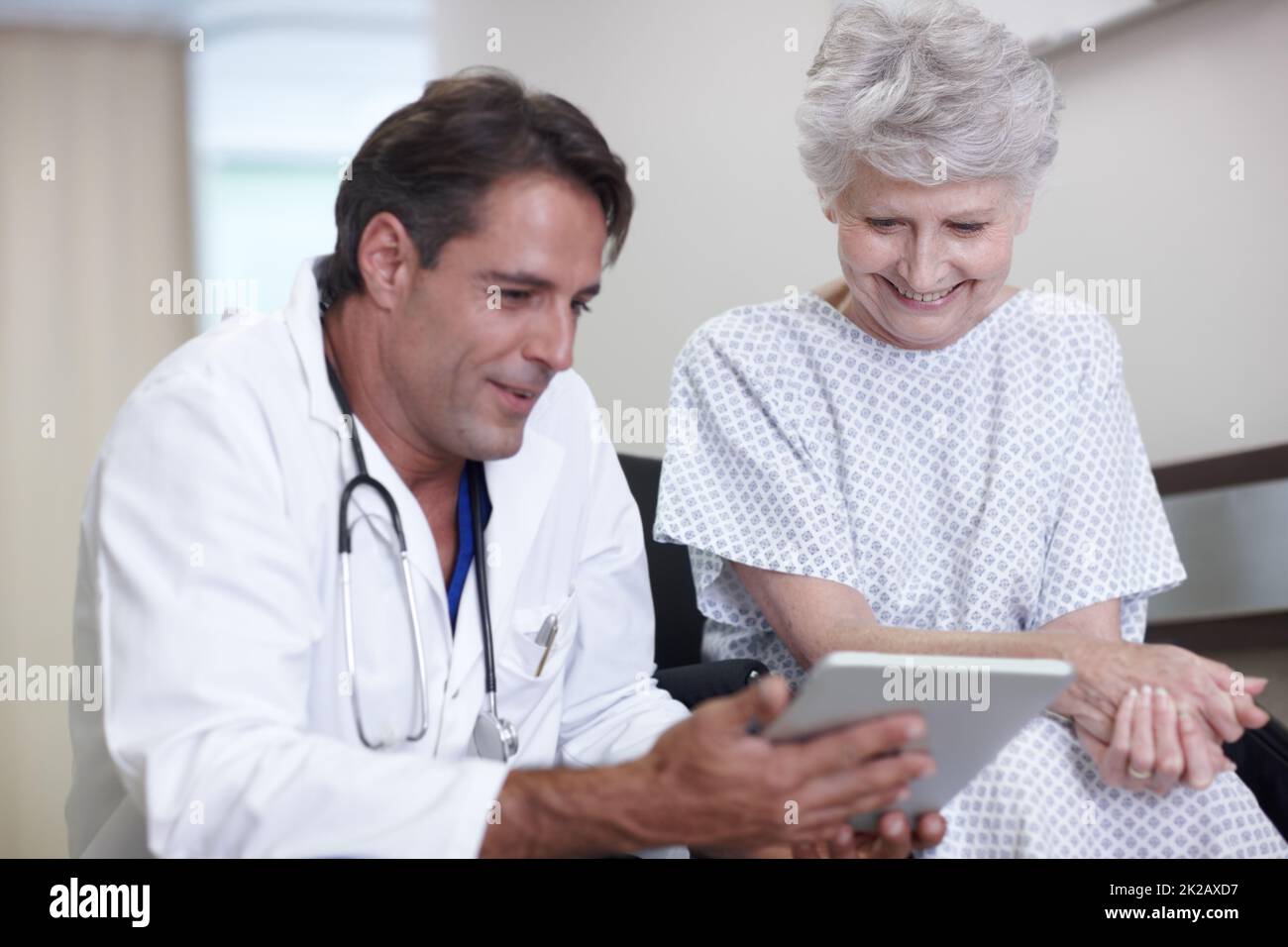 Your tests came back all clear. A male doctor giving his senior patient ...