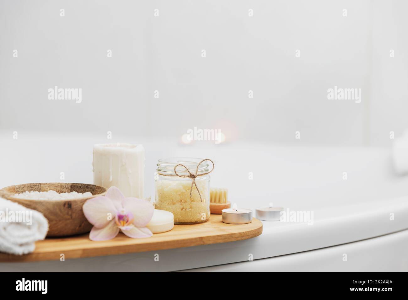 Hotel spa treatment or home bath procedure. Bathroom with accessories ...